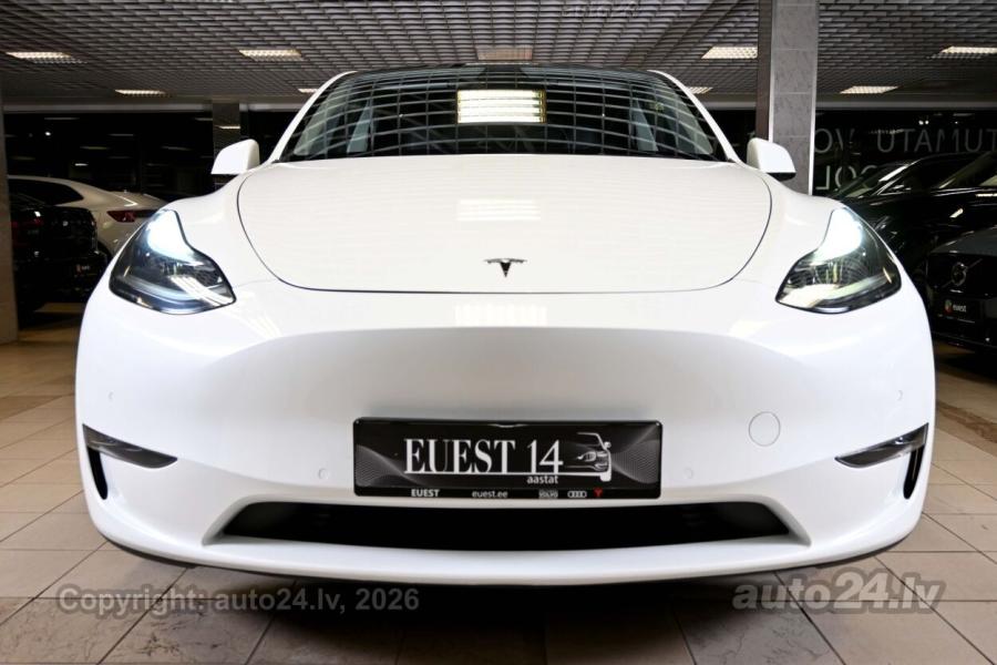 White Tesla Model Y 2022 in Tallinn, with an engine capacity of 0.00 L and mileage of 81 thousand km for 38990 €, photo 6 on AUTOMOTO.COM.LV