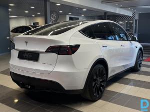 White Tesla Model Y 2022 in Marupe, with an engine capacity of 0.00 L and mileage of 101 thousand km for 31990 €, photo 3 on AUTOMOTO.COM.LV
