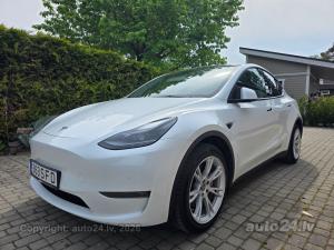 White Tesla Model Y 2022 in Tallinn, with an engine capacity of 0.00 L and mileage of 83 thousand km for 33000 €, photo 3 on AUTOMOTO.COM.LV