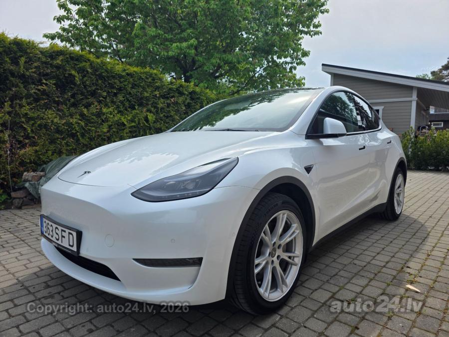 White Tesla Model Y 2022 in Tallinn, with an engine capacity of 0.00 L and mileage of 83 thousand km for 33000 €, photo 3 on AUTOMOTO.COM.LV
