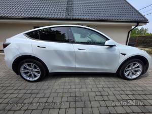 White Tesla Model Y 2022 in Tallinn, with an engine capacity of 0.00 L and mileage of 83 thousand km for 33000 €, photo 4 on AUTOMOTO.COM.LV