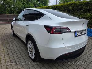 White Tesla Model Y 2022 in Tallinn, with an engine capacity of 0.00 L and mileage of 83 thousand km for 33000 €, photo 5 on AUTOMOTO.COM.LV