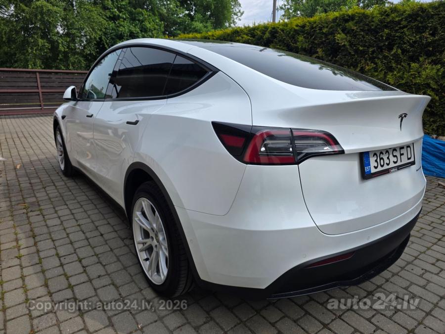 White Tesla Model Y 2022 in Tallinn, with an engine capacity of 0.00 L and mileage of 83 thousand km for 33000 €, photo 5 on AUTOMOTO.COM.LV