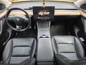 White Tesla Model Y 2022 in Tallinn, with an engine capacity of 0.00 L and mileage of 83 thousand km for 33000 €, photo 6 on AUTOMOTO.COM.LV