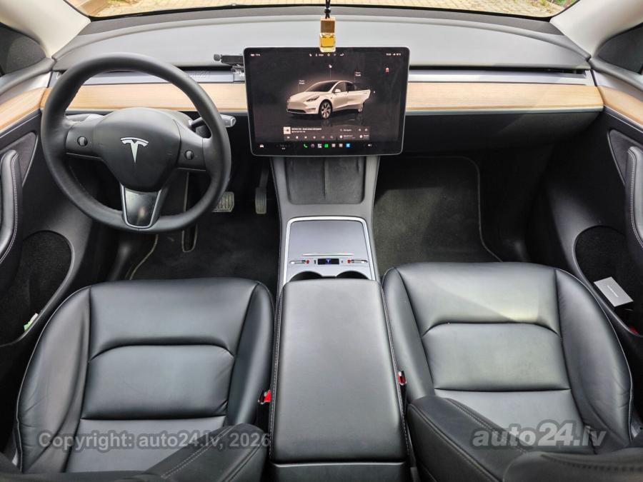White Tesla Model Y 2022 in Tallinn, with an engine capacity of 0.00 L and mileage of 83 thousand km for 33000 €, photo 6 on AUTOMOTO.COM.LV