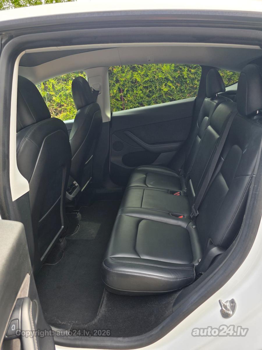 White Tesla Model Y 2022 in Tallinn, with an engine capacity of 0.00 L and mileage of 83 thousand km for 33000 €, photo 10 on AUTOMOTO.COM.LV