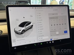 White Tesla Model Y 2022 in Riga, with an engine capacity of 0.00 L and mileage of 105 thousand km for 32990 €, photo 13 on AUTOMOTO.COM.LV