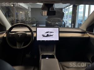 White Tesla Model Y 2022 in Riga, with an engine capacity of 0.00 L and mileage of 105 thousand km for 32990 €, photo 19 on AUTOMOTO.COM.LV