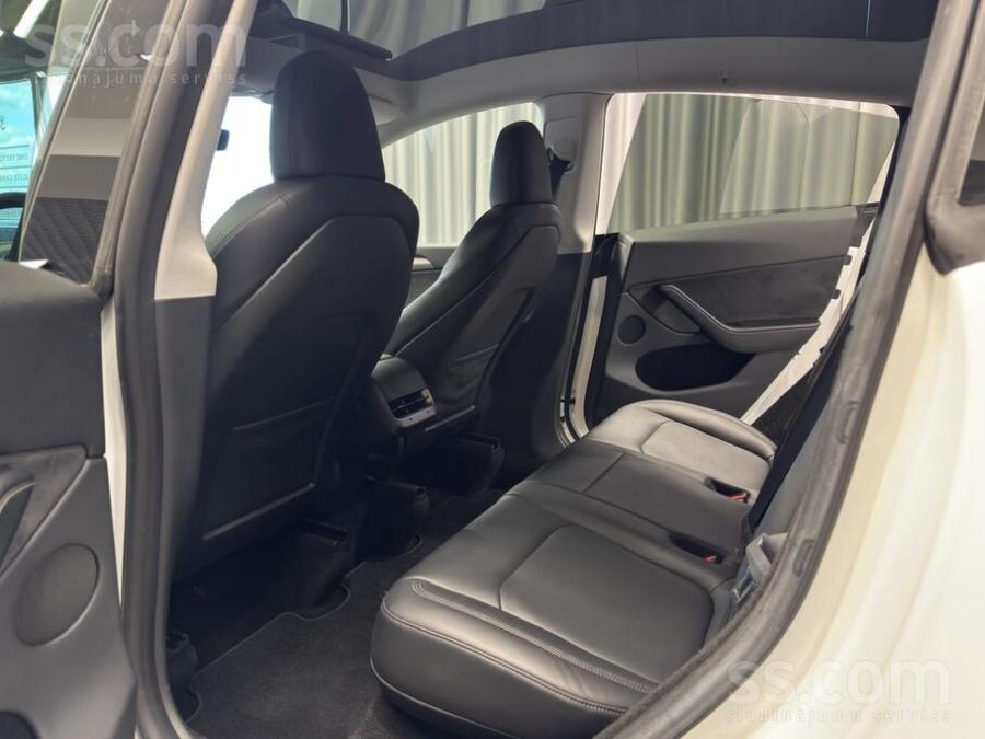 White Tesla Model Y 2022 in Riga, with an engine capacity of 0.00 L and mileage of 105 thousand km for 32990 €, photo 24 on AUTOMOTO.COM.LV