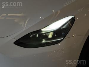 White Tesla Model Y 2022 in Riga, with an engine capacity of 0.00 L and mileage of 105 thousand km for 32990 €, photo 29 on AUTOMOTO.COM.LV