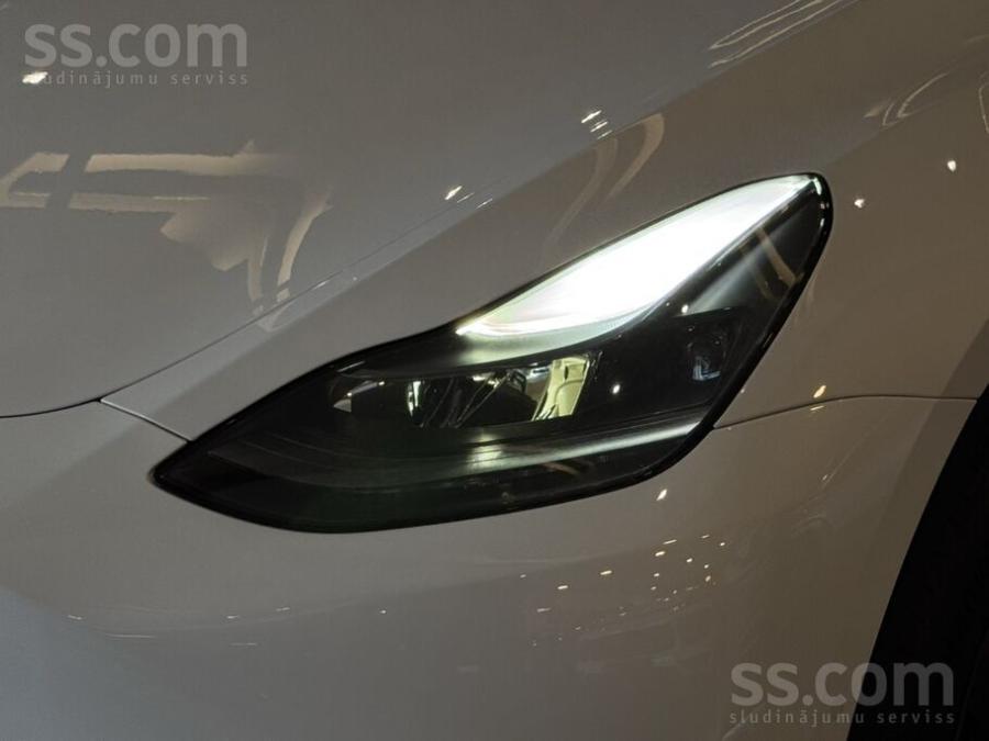 White Tesla Model Y 2022 in Riga, with an engine capacity of 0.00 L and mileage of 105 thousand km for 32990 €, photo 29 on AUTOMOTO.COM.LV