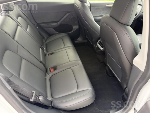 White Tesla Model Y 2022 in Riga, with an engine capacity of 0.00 L and mileage of 114 thousand km for 32300 €, photo 9 on AUTOMOTO.COM.LV