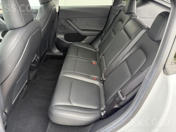 White Tesla Model Y 2022 in Riga, with an engine capacity of 0.00 L and mileage of 114 thousand km for 32300 €, photo 10 on AUTOMOTO.COM.LV