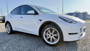 White Tesla Model Y 2022 in Siauliai, with an engine capacity of 0.00 L and mileage of 97 thousand km for 24650 €, photo 5 on AUTOMOTO.COM.LV