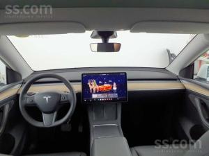 White Tesla Model Y 2022 in Riga, with an engine capacity of 0.00 L and mileage of 74 thousand km for 33990 €, photo 8 on AUTOMOTO.COM.LV