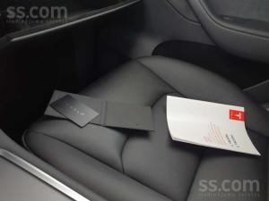 White Tesla Model Y 2022 in Riga, with an engine capacity of 0.00 L and mileage of 74 thousand km for 33990 €, photo 18 on AUTOMOTO.COM.LV