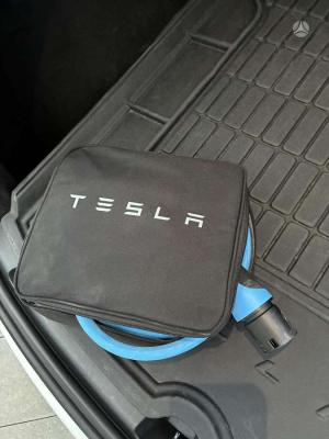White Tesla Model Y 2022 in Vilnius, with an engine capacity of 0.00 L and mileage of 76 thousand km for 32500 €, photo 33 on AUTOMOTO.COM.LV