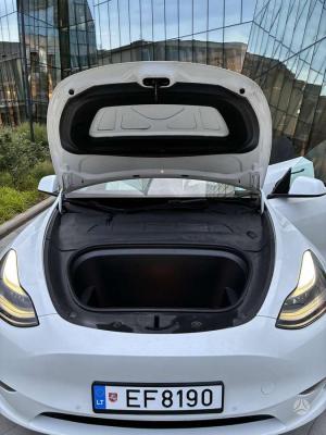 White Tesla Model Y 2022 in Vilnius, with an engine capacity of 0.00 L and mileage of 76 thousand km for 32500 €, photo 35 on AUTOMOTO.COM.LV