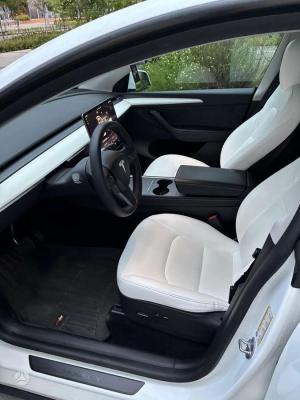 White Tesla Model Y 2022 in Vilnius, with an engine capacity of 0.00 L and mileage of 76 thousand km for 32500 €, photo 38 on AUTOMOTO.COM.LV