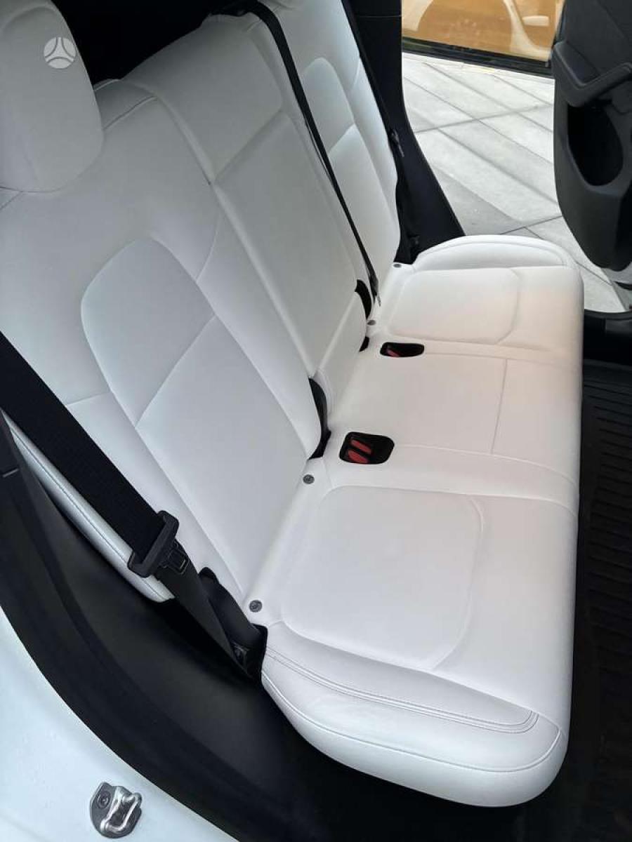 White Tesla Model Y 2022 in Vilnius, with an engine capacity of 0.00 L and mileage of 76 thousand km for 32500 €, photo 42 on AUTOMOTO.COM.LV