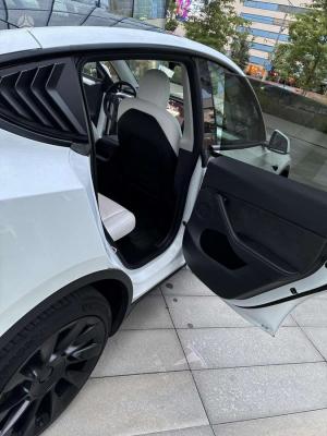 White Tesla Model Y 2022 in Vilnius, with an engine capacity of 0.00 L and mileage of 76 thousand km for 32500 €, photo 43 on AUTOMOTO.COM.LV