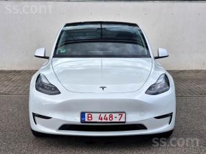White Tesla Model Y 2022 in Riga, with an engine capacity of 0.00 L and mileage of 69 thousand km for 33750 €, photo 3 on AUTOMOTO.COM.LV