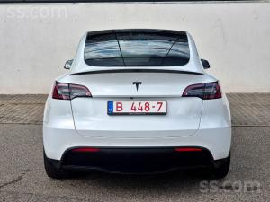 White Tesla Model Y 2022 in Riga, with an engine capacity of 0.00 L and mileage of 69 thousand km for 33750 €, photo 8 on AUTOMOTO.COM.LV