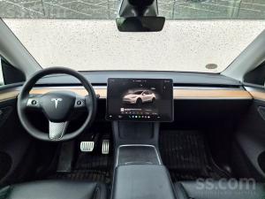 White Tesla Model Y 2022 in Riga, with an engine capacity of 0.00 L and mileage of 69 thousand km for 33750 €, photo 10 on AUTOMOTO.COM.LV