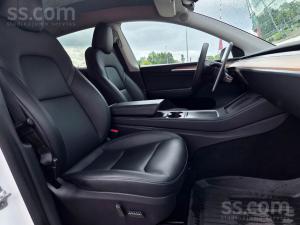 White Tesla Model Y 2022 in Riga, with an engine capacity of 0.00 L and mileage of 69 thousand km for 33750 €, photo 12 on AUTOMOTO.COM.LV