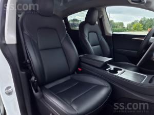 White Tesla Model Y 2022 in Riga, with an engine capacity of 0.00 L and mileage of 69 thousand km for 33750 €, photo 14 on AUTOMOTO.COM.LV