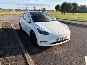 White Tesla Model Y 2022 in Kaunas, with an engine capacity of 0.00 L and mileage of 68 thousand km for 34000 €, photo  on AUTOMOTO.COM.LV