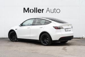 White Tesla Model Y 2022 in Riga, with an engine capacity of 0.00 L and mileage of 98 thousand km for 38900 €, photo 4 on AUTOMOTO.COM.LV