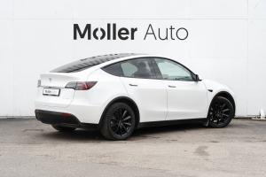 White Tesla Model Y 2022 in Riga, with an engine capacity of 0.00 L and mileage of 98 thousand km for 38900 €, photo 5 on AUTOMOTO.COM.LV