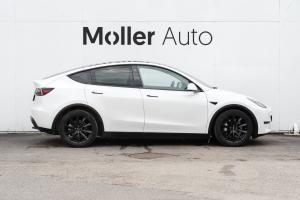 White Tesla Model Y 2022 in Riga, with an engine capacity of 0.00 L and mileage of 98 thousand km for 38900 €, photo 6 on AUTOMOTO.COM.LV