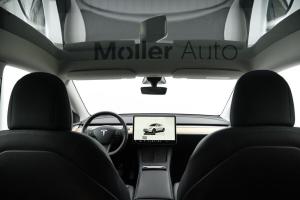White Tesla Model Y 2022 in Riga, with an engine capacity of 0.00 L and mileage of 98 thousand km for 38900 €, photo 25 on AUTOMOTO.COM.LV