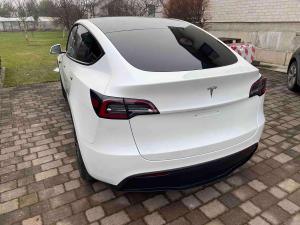 White Tesla Model Y 2023 in Vilnius, with an engine capacity of 0.00 L and mileage of 47 thousand km for 24500 €, photo 5 on AUTOMOTO.COM.LV