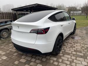 White Tesla Model Y 2023 in Vilnius, with an engine capacity of 0.00 L and mileage of 47 thousand km for 24500 €, photo  on AUTOMOTO.COM.LV