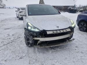 White Tesla Model Y 2023 in Marijampole, with an engine capacity of 0.00 L and mileage of 65 thousand km for 19000 €, photo  on AUTOMOTO.COM.LV