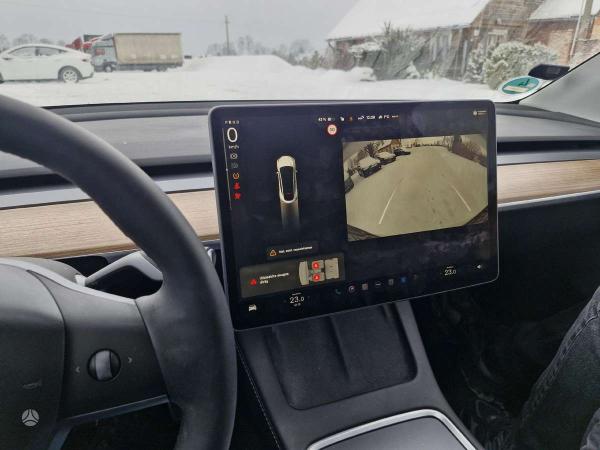 White Tesla Model Y 2023 in Marijampole, with an engine capacity of 0.00 L and mileage of 65 thousand km for 19000 €, photo 11 on AUTOMOTO.COM.LV