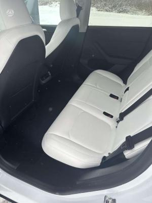 White Tesla Model Y 2023 in Vilnius, with an engine capacity of 0.00 L and mileage of 62 thousand km for 33500 €, photo 10 on AUTOMOTO.COM.LV