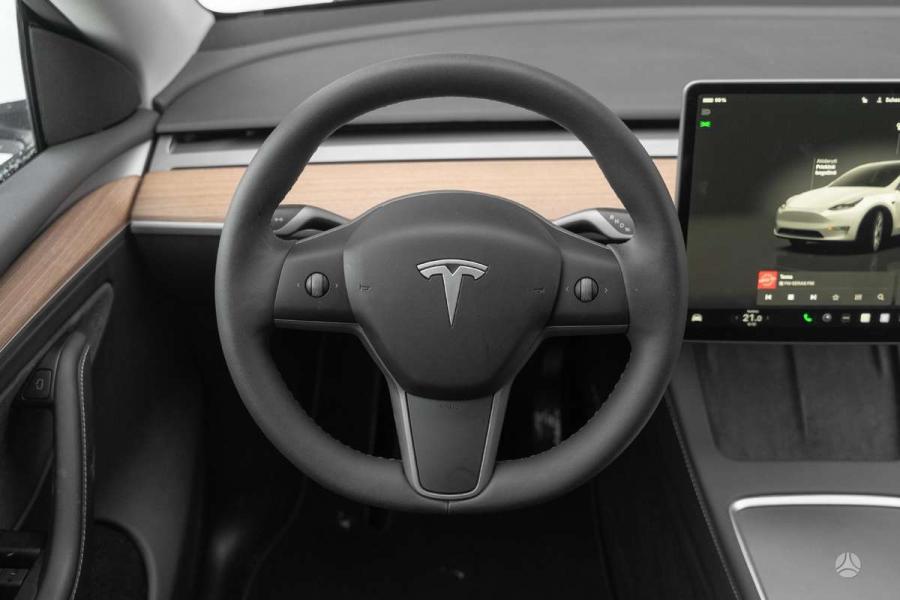 White Tesla Model Y 2023 in Vilnius, with an engine capacity of 0.00 L and mileage of 60 thousand km for 33950 €, photo 16 on AUTOMOTO.COM.LV