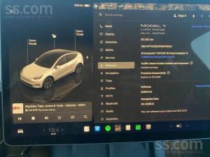 White Tesla Model Y 2023 in Riga, with an engine capacity of 0.00 L and mileage of 84 thousand km for 31500 €, photo 9 on AUTOMOTO.COM.LV