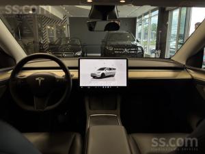 White Tesla Model Y 2023 in Riga, with an engine capacity of 0.00 L and mileage of 77 thousand km for 31990 €, photo 14 on AUTOMOTO.COM.LV