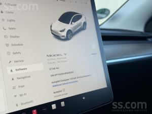 White Tesla Model Y 2023 in Riga, with an engine capacity of 0.00 L and mileage of 58 thousand km for 38900 €, photo 10 on AUTOMOTO.COM.LV