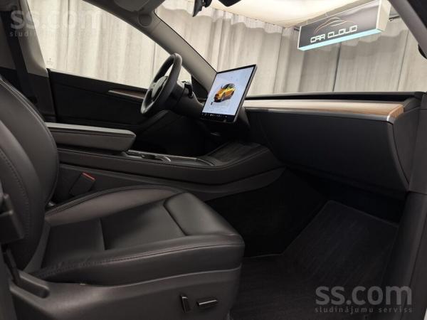 Balts Tesla Model Y 2023 Rīga, ar dzinēja tilpumu 0.00 L un nobraukumu 136 tūkst. km par 29990 €, foto 10 vietnē AUTOMOTO.COM.LV