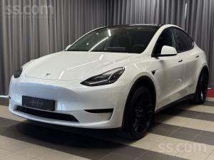 Белый Тесла Модель Y 2023 в Рига, объемом двигателя 0.00 л и пробегом 77 тыс. км за 31990 €, фото  на AUTOMOTO.COM.LV