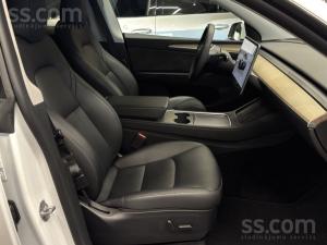White Tesla Model Y 2023 in Riga, with an engine capacity of 0.00 L and mileage of 77 thousand km for 31990 €, photo 13 on AUTOMOTO.COM.LV