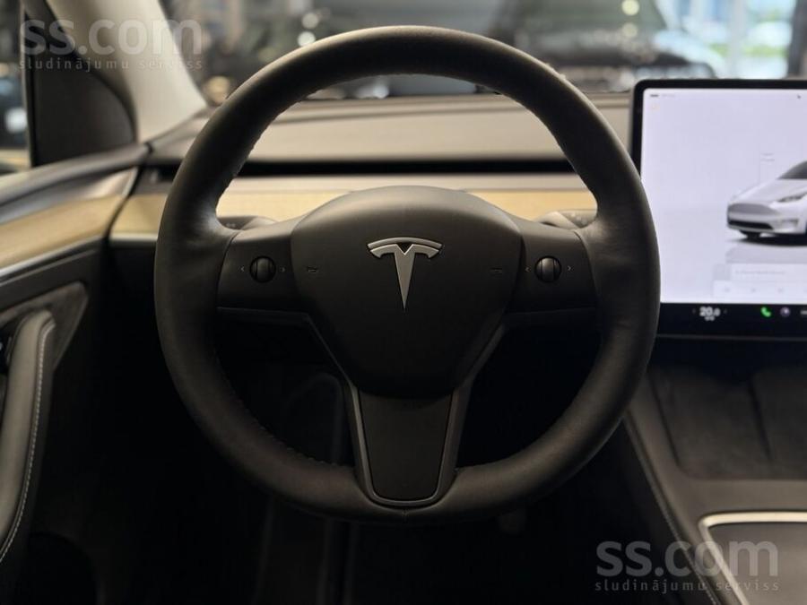 White Tesla Model Y 2023 in Riga, with an engine capacity of 0.00 L and mileage of 77 thousand km for 31990 €, photo 15 on AUTOMOTO.COM.LV
