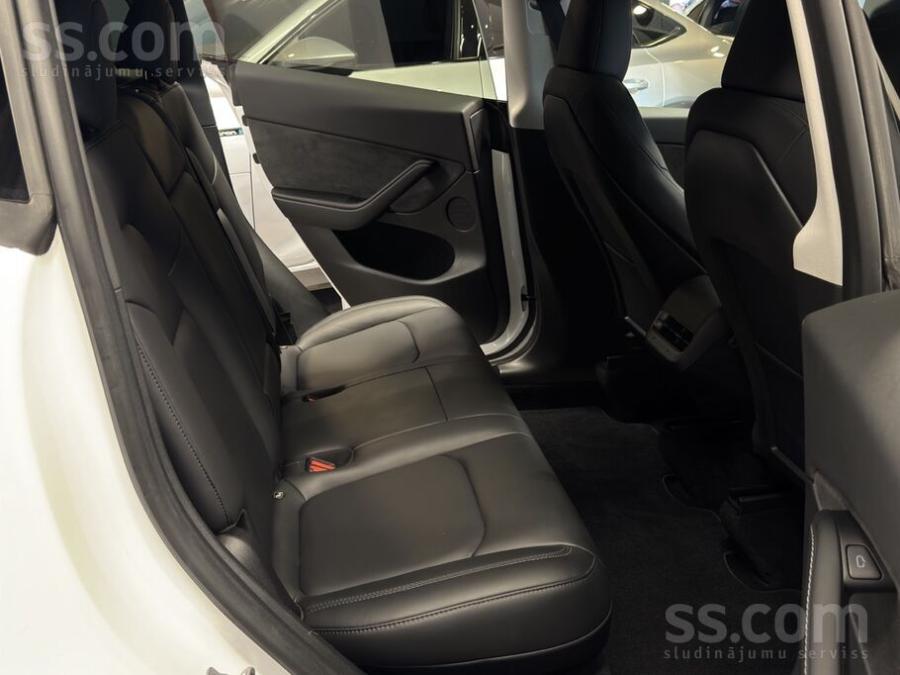 White Tesla Model Y 2023 in Riga, with an engine capacity of 0.00 L and mileage of 77 thousand km for 31990 €, photo 25 on AUTOMOTO.COM.LV