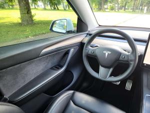 White Tesla Model Y 2023 in Vilnius, with an engine capacity of 0.00 L and mileage of 276 thousand km for 21900 €, photo 14 on AUTOMOTO.COM.LV